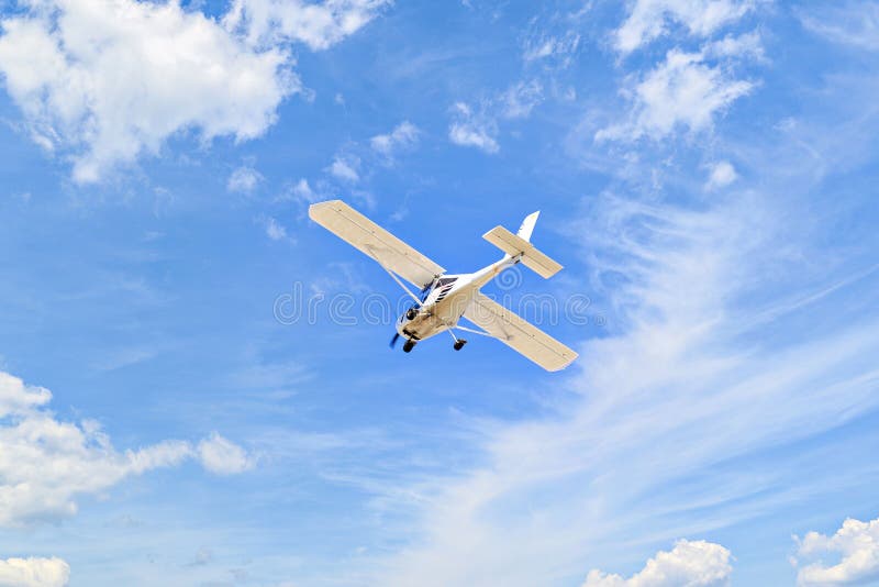 Low Angle Shot of a Single Engine Ultralight Plane Flying in the Blue ...