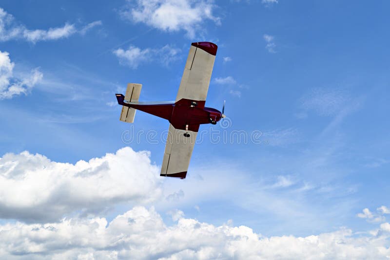 Low Angle Shot of a Single Engine Ultralight Plane Flying in the Blue ...