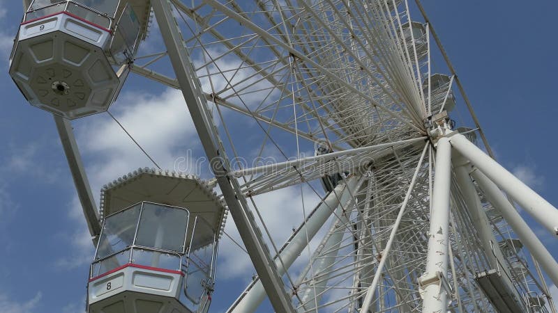 Low Angle Shot of a Spinning Ferris Wheel Under a Blue Sky Stock ...