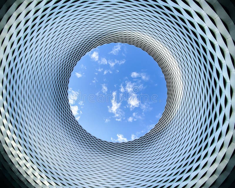 Low Angle Shot of a Spiral Round Hole Facing a Bright Blue Sky Stock ...