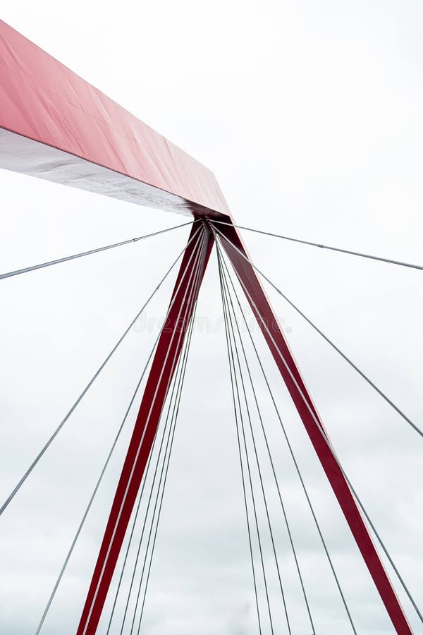 Low Angle Shot of a Structure with Wires and Red Frames Against the Sky ...