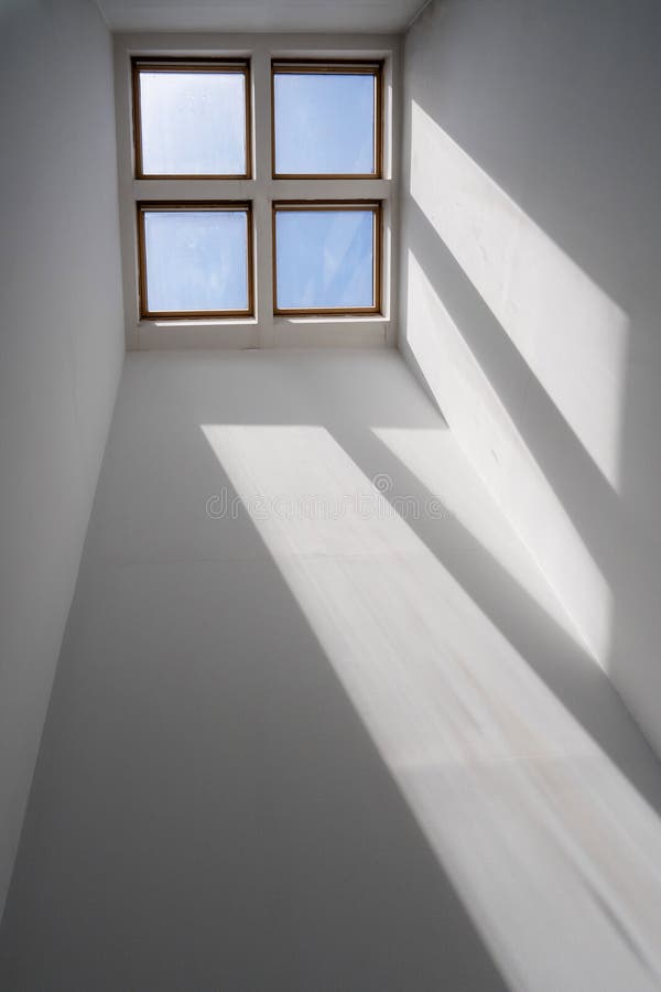 Low Angle Shot of Sun Rays Falling from a High Window into the House ...