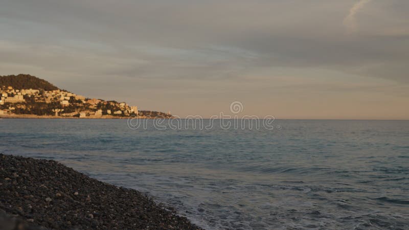 Low Angle Shot of Sunset on a Pebble Beach of Nice Stock Image - Image ...