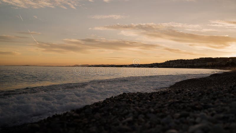 Low Angle Shot of Sunset on a Pebble Beach of Nice Stock Image - Image ...