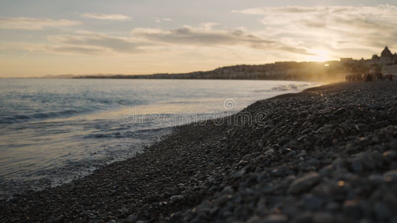 Low Angle Shot of Sunset on a Pebble Beach of Nice Stock Image - Image ...