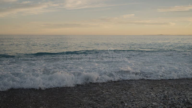 Low Angle Shot of Sunset on a Pebble Beach of Nice Stock Photo - Image ...