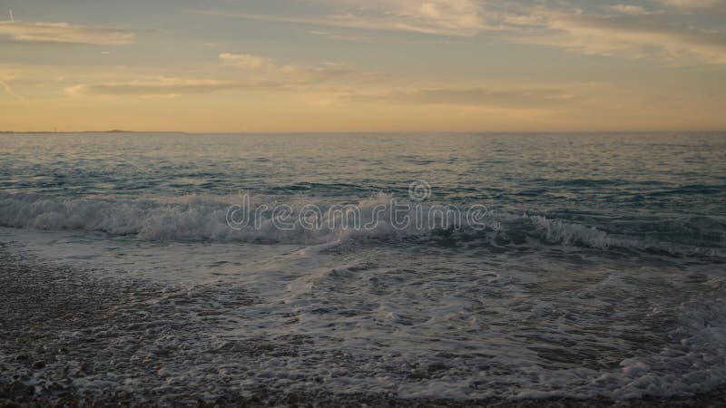 Low Angle Shot of Sunset on a Pebble Beach of Nice Stock Photo - Image ...
