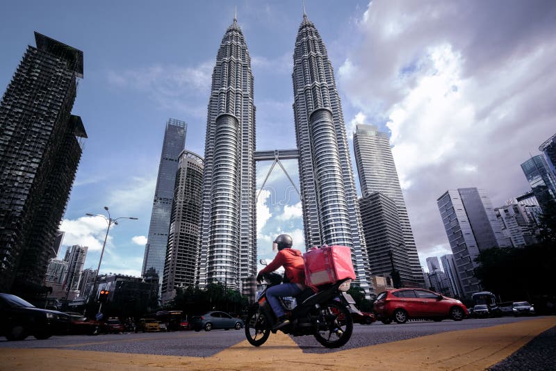 Low-angle Shot of a Tall Building with a Crowded Street Stock Image ...