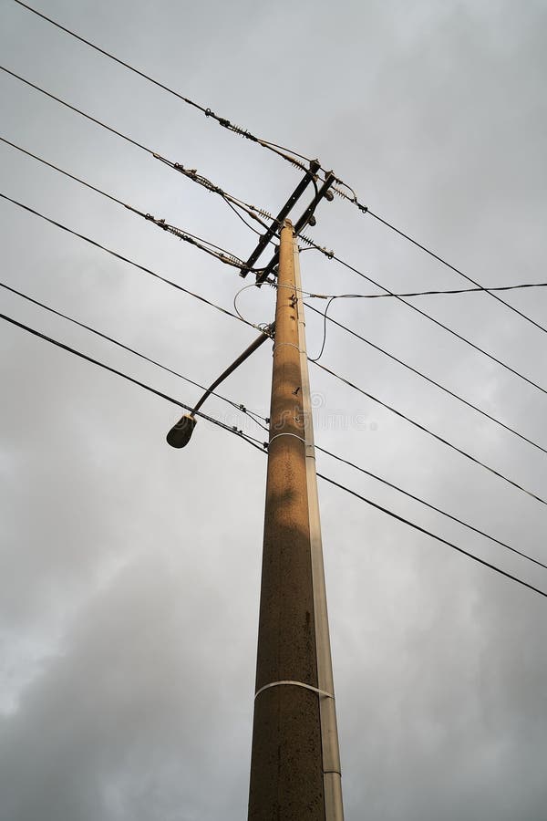 Low-angle Shot of the Tall Electric Pole with Telephone Wires Extending ...