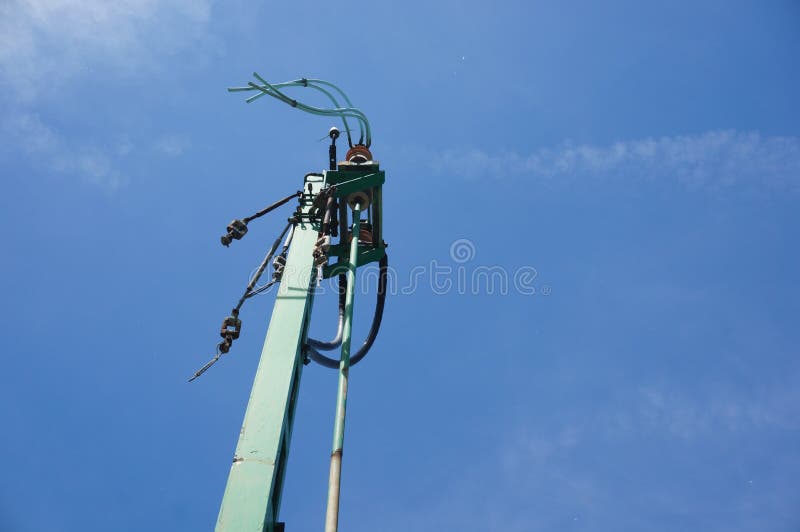 Low Angle Shot of a Tall Electricity Pole Under a Blue Sky Stock Photo ...