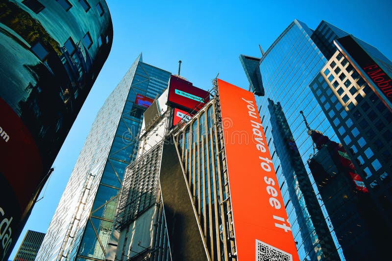 Low-angle Shot of Time Square Buildings with Advertisements Under the ...