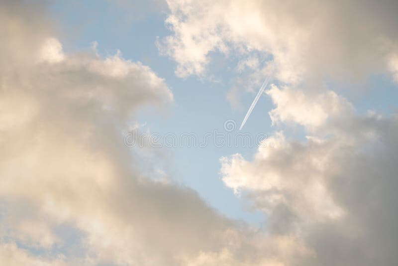 Low Angle Shot of a Tiny Plane at a Distance Flying in Blue Sky with ...