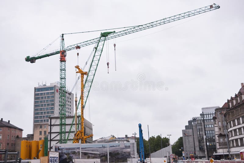 Low Angle Shot of a Tower Crane on a Cloudy Sky Background Stock Photo ...