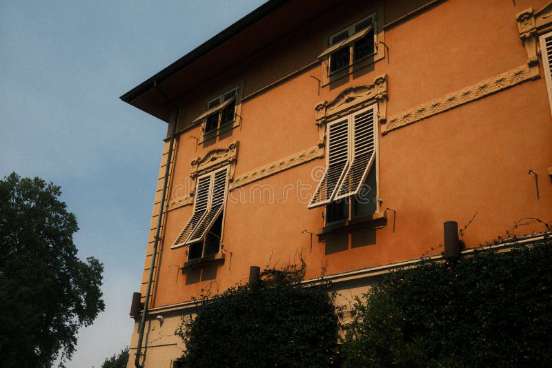 Low-angle Shot of a Traditional Italian House in Orange with Windows ...