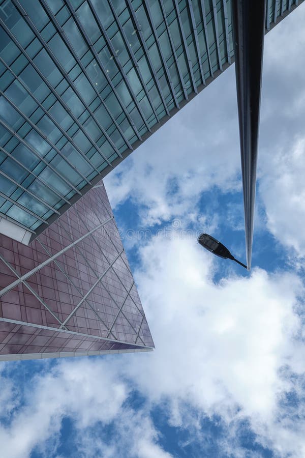 Low Angle Shot of Two Connected Buildings Reaching Towards the Sky, in ...