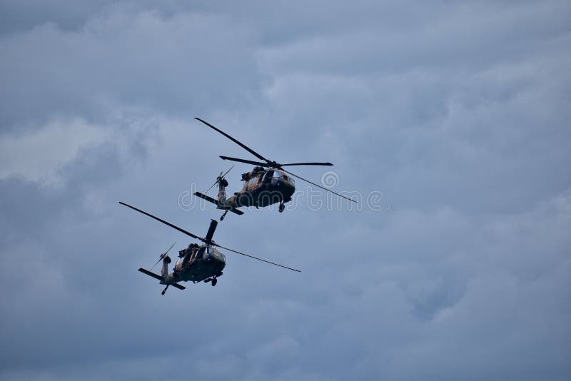 Low-angle Shot of Two Helicopters Flying in the Sky Editorial Photo ...