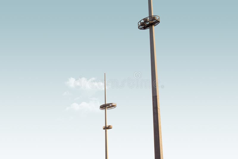 Low Angle Shot of Two Lamp Post Towers Under the Blue Sky Stock Photo ...