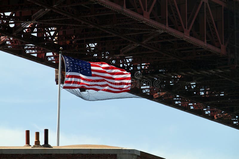Low Angle Shot of the US Flag Under a Metal Construction Stock Photo ...