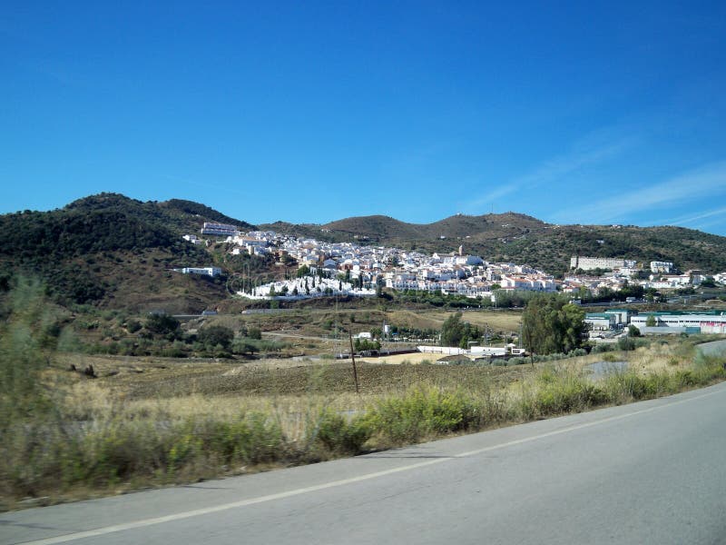 Low Angle Shot of a Village in the Middle of the Mountains on the Side ...