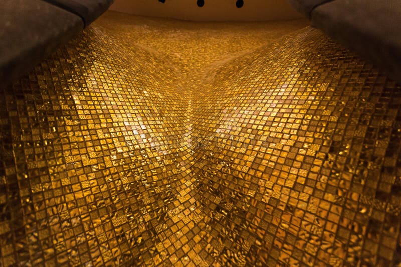 Low Angle Shot of a Wall Decorated with Small Golden Shiny Tiles Stock ...