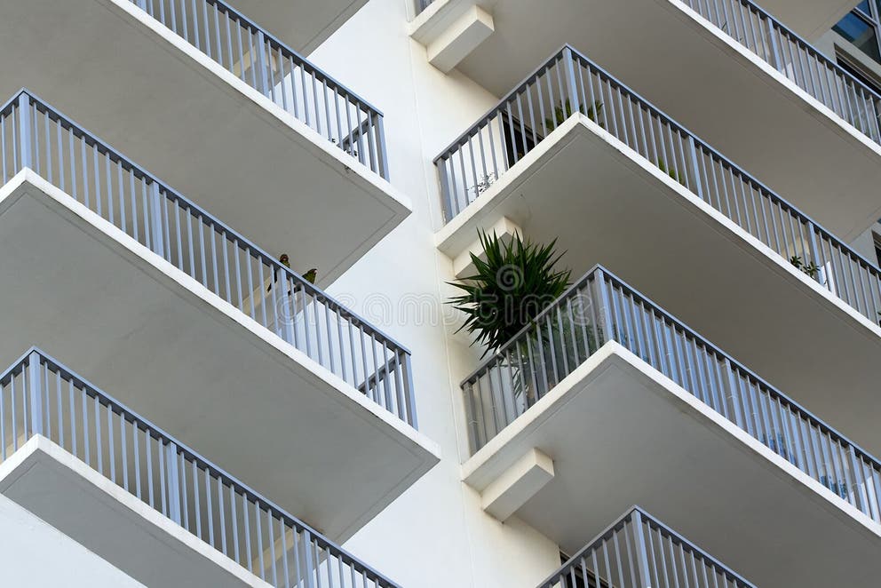 Low-angle Shot of a White Building with Balconies Stock Photo - Image ...