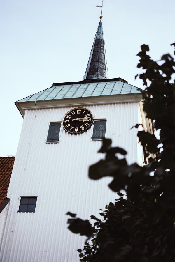Low Angle Shot of White Building with Windows and Black Clock, Golden ...