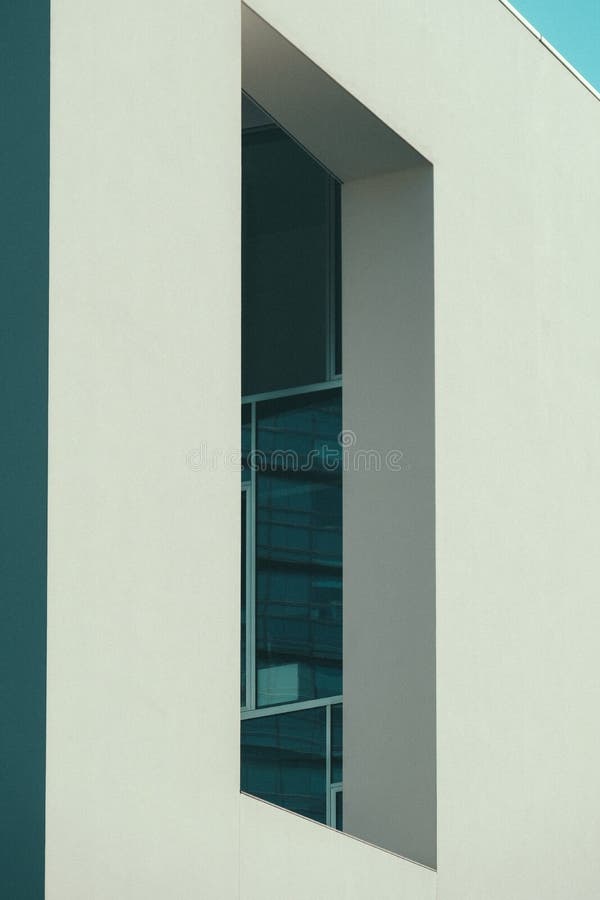 Low Angle Shot of a White Wall of a Modern Building with a Square Hole ...