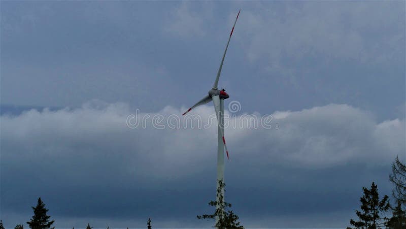 Low Angle Shot of a Wind Turbine on a Cloudy Sky Background Stock Photo ...