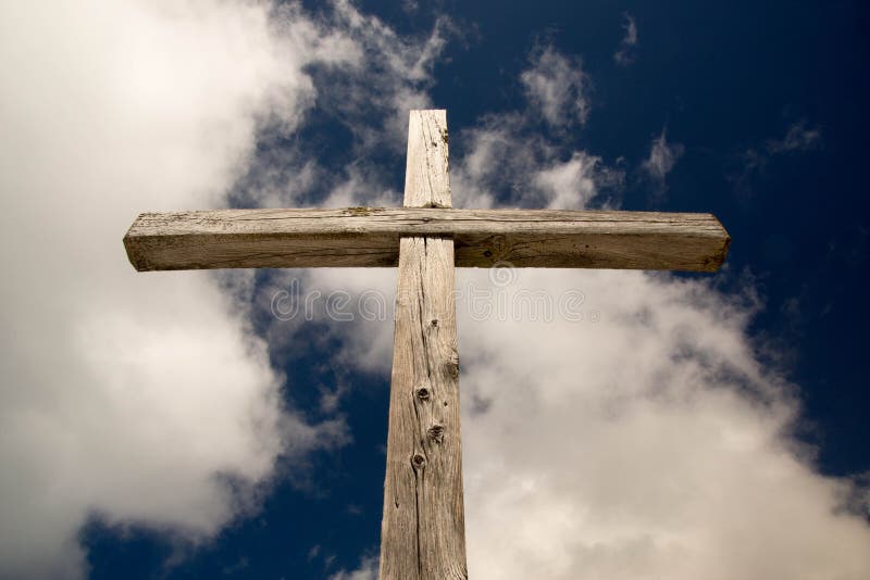 Low Angle Shot of a Wooden Cross Under the Clouds Stock Photo - Image ...