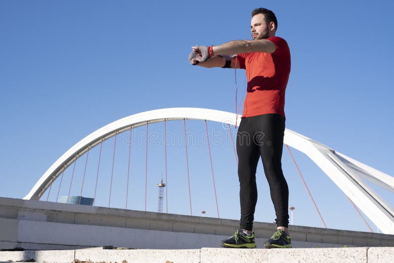 Low Angle Shot of a Young Male Warming Up for a Workout Stock Photo ...