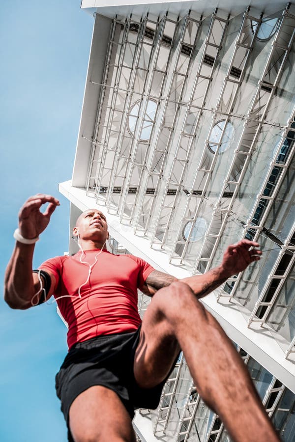 Low Angle of a Fast Running Man Stock Photo - Image of athletic, shorts ...