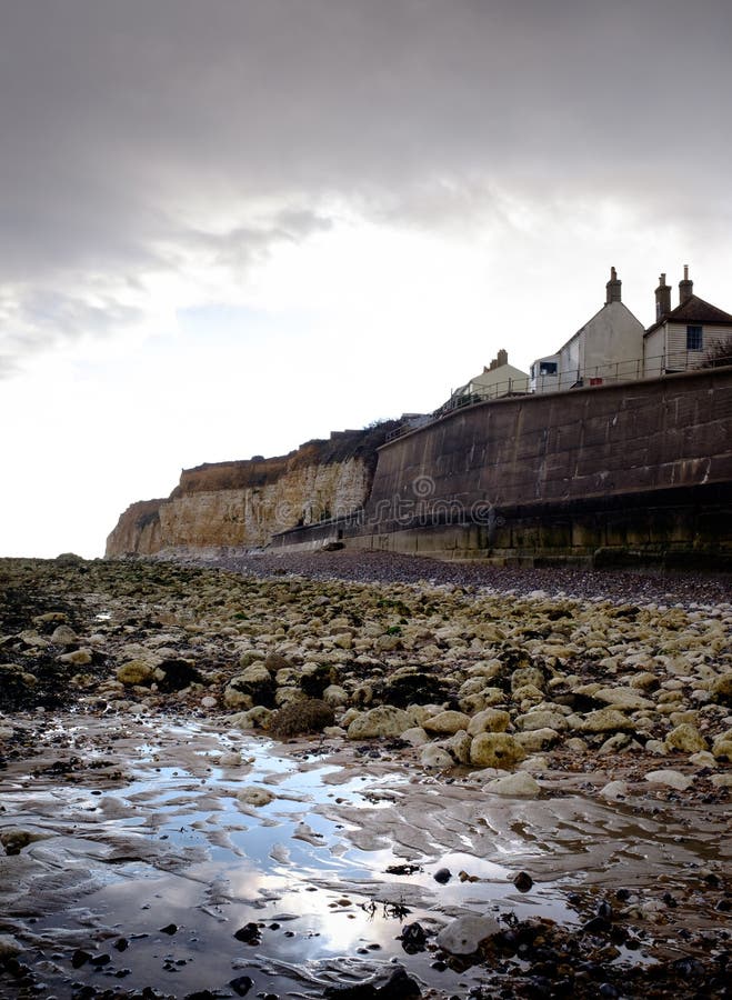 Low Angle Vertical Shot of a Building on Top of a Cliff during Low Tide ...
