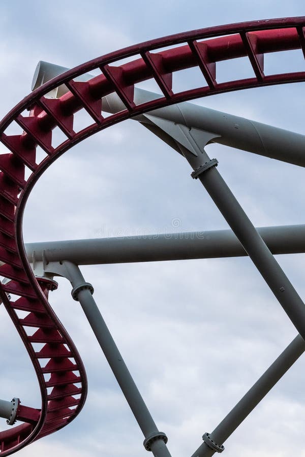 Low Angle Vertical Shot of a Roller Coaster Metal Track in an Amusement ...