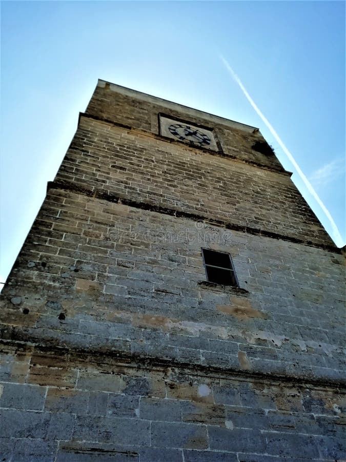 Low Angle Vertical Shot of a Stone-made Historical Clock Tower Under a ...