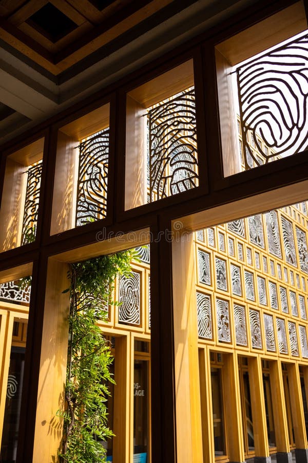 Low-angle Vertical Shot of Wooden Windows with Intricate Designs Stock ...
