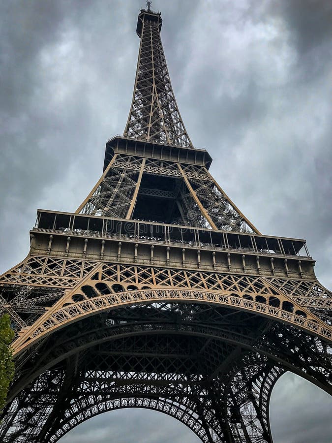 Low-angle Vertical View of the Famous Eiffel Tower before the Cloudy ...