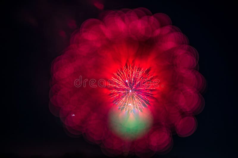 Low Angle of a Vibrant Display of Red and Green Fireworks in a Dark ...