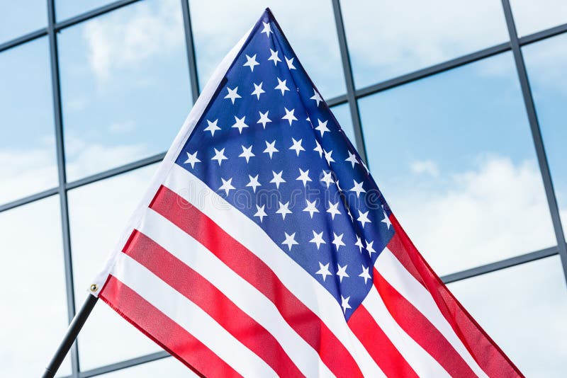 Angle View of American Flag Near Glass Building with Windows Stock ...