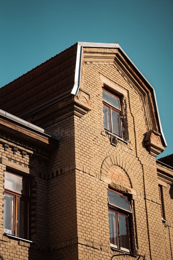 A Low-angle View Captures the Upper Portion of an Old Brick Building ...