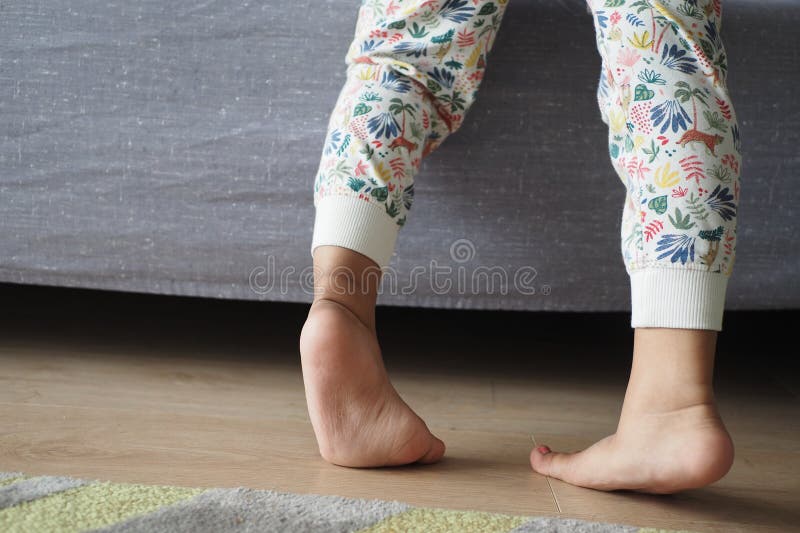 Low Angle View of a Child Walking on Tiptoes Stock Photo - Image of ...