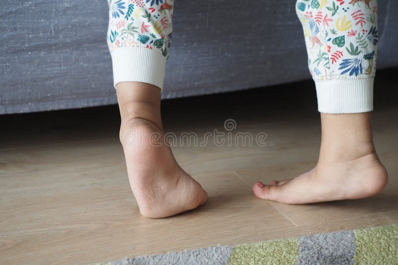 Low Angle View of a Child Walking on Tiptoes Stock Photo - Image of ...