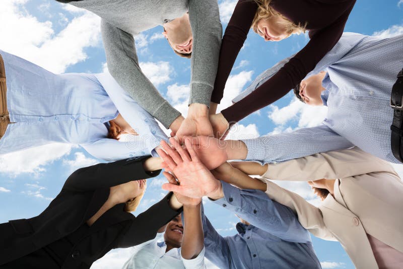 Low Angle View of College Students Stacking Their Hands Stock Photo ...