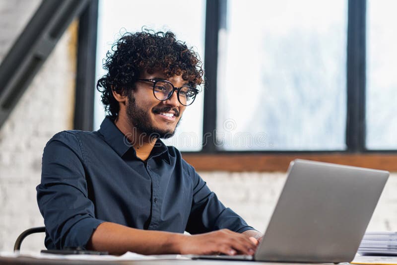 Low Angle View of the Concentrated Man Looking at the Laptop Screen ...