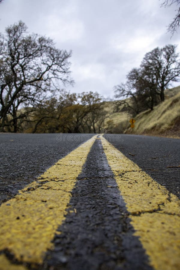 Low Angle View Down the Middle of a Mountain Road Stock Image - Image ...