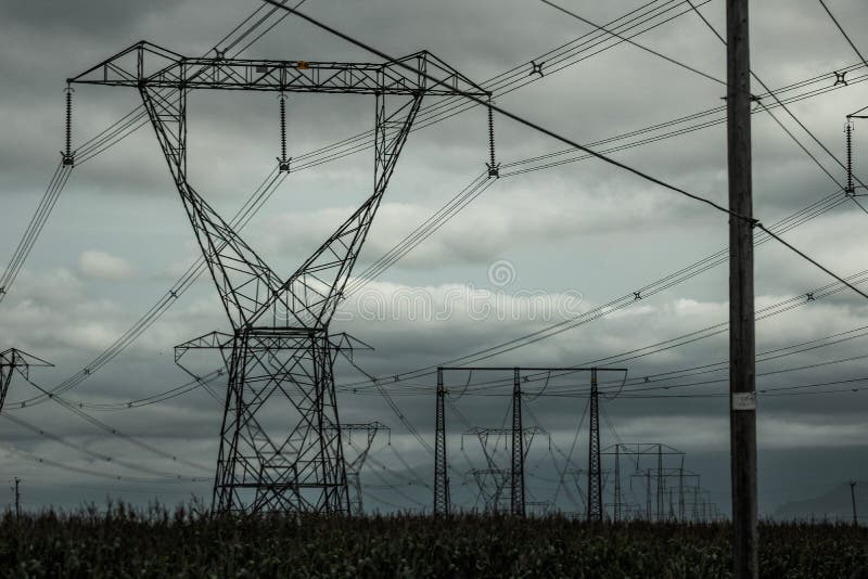 Low-angle View of Electrical Grid Towers on a Cloudy Day Stock Image ...