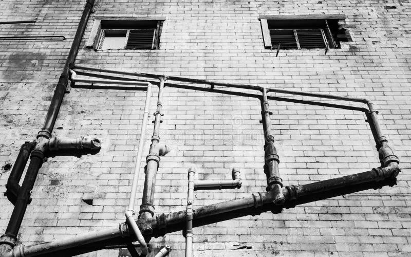 External Plumbing on Side of Old Building Stock Photo - Image of angle ...