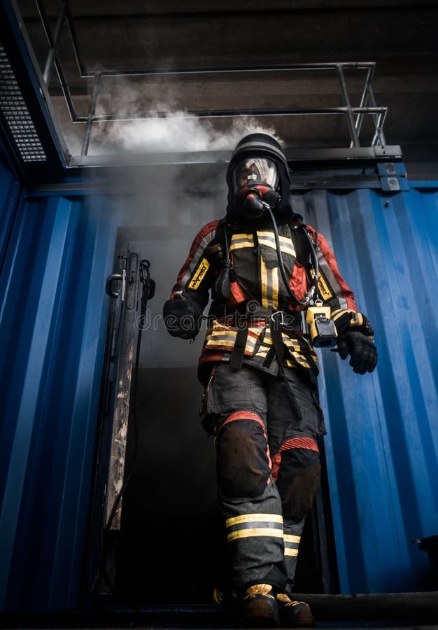 Low Angle View of Firefighter Wearing Firefighter Uniform Stock Photo ...