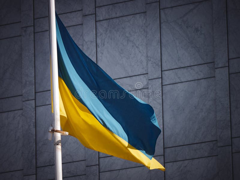 Low Angle View of Flag Waving Against Building Stock Image - Image of ...