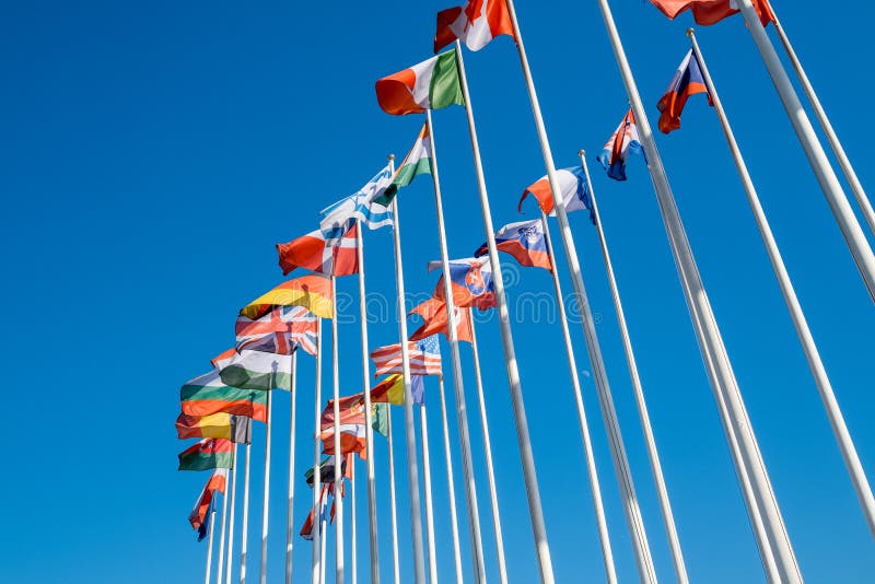 Different Flags Fluttering on Flagpoles Stock Photo - Image of daytime ...