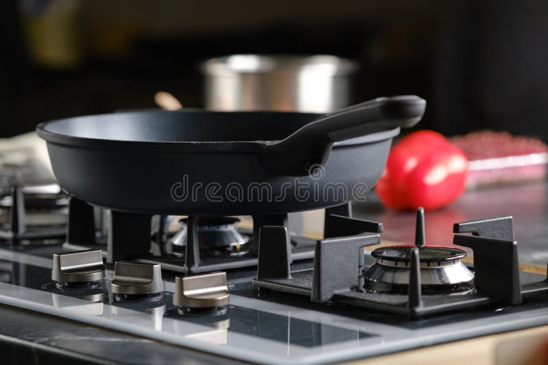 Low Angle View of Frying Pan on a Gas Stove Stock Photo - Image of ...